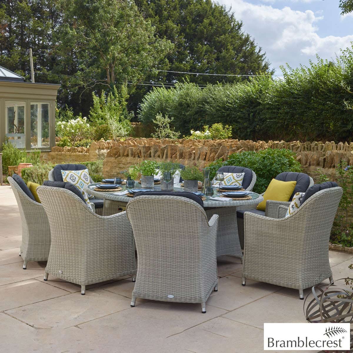 Bramblecrest Monterey 8 Piece Rattan Oval Fire Dining Set...